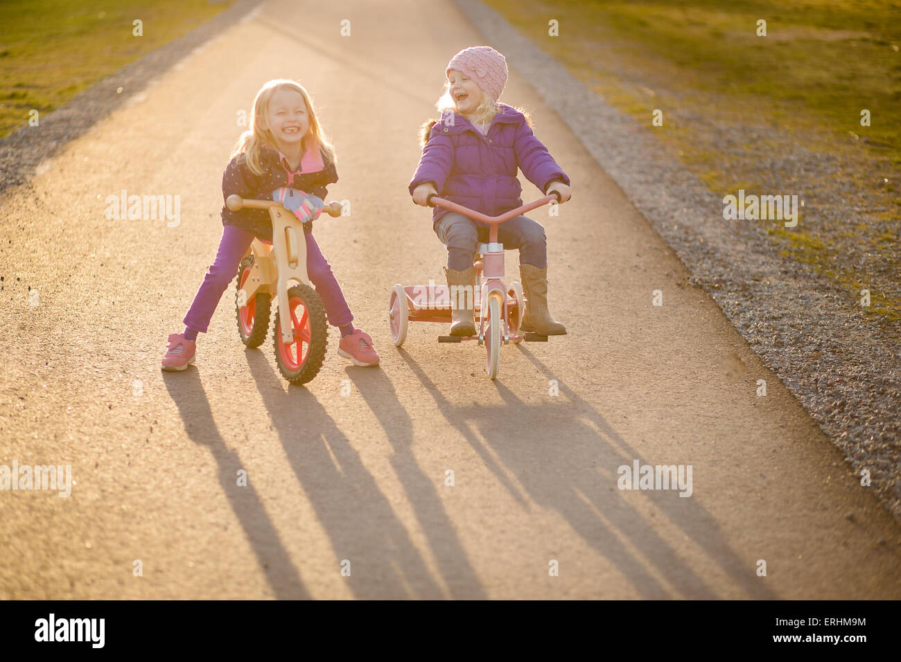 Two girls on bikes hi-res stock photography and images - Alamy