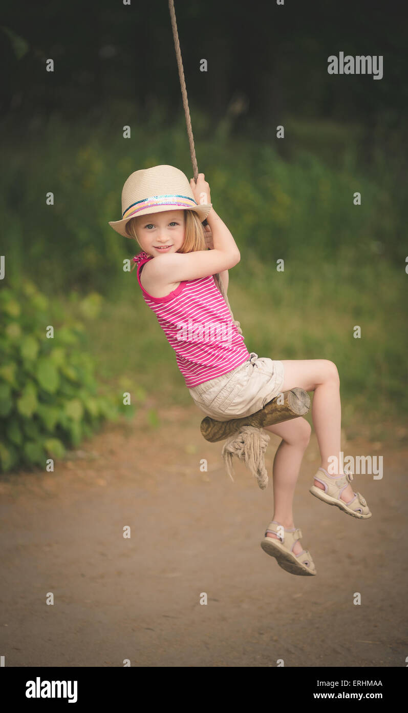 Girls playing swinging swing rope hi-res stock photography and images ...