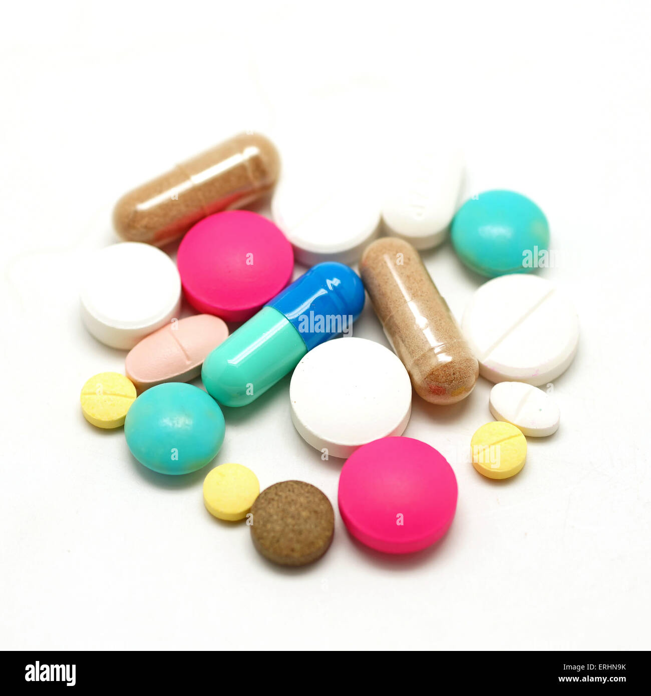 pile of pills isolated on white background Stock Photo - Alamy