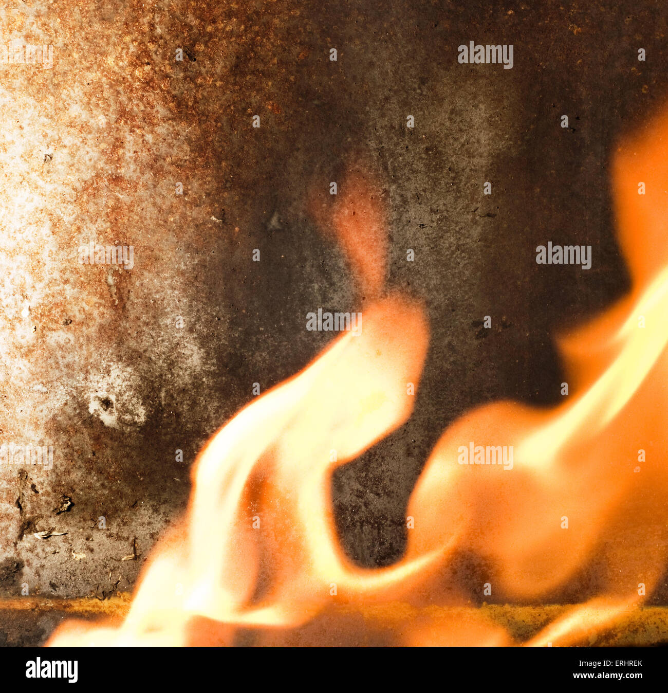 Rusty metal texture and flames of fire around it Stock Photo - Alamy