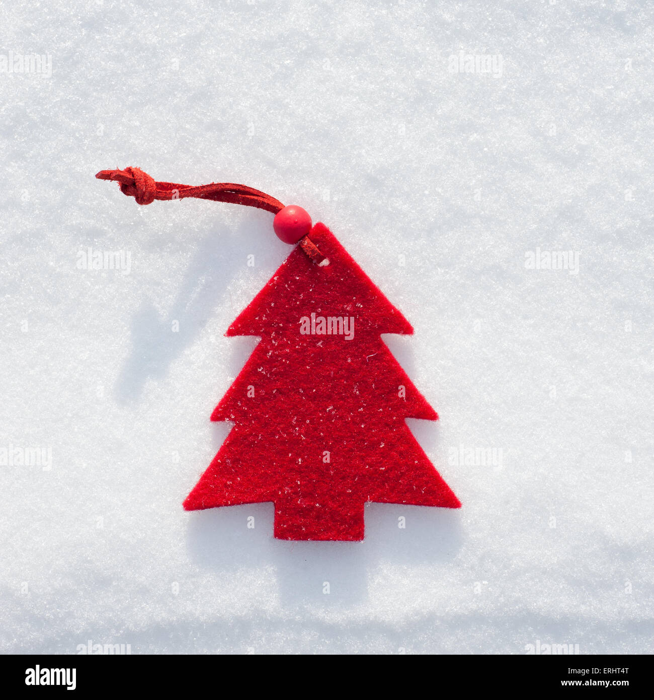 plushy red fir tree toy on snow background Stock Photo - Alamy