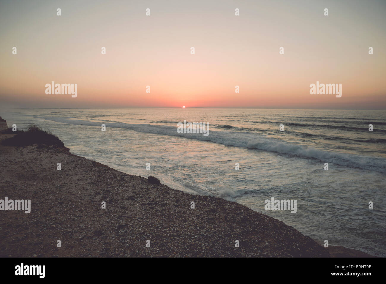 Beautiful orange sunset at the beach Stock Photo - Alamy