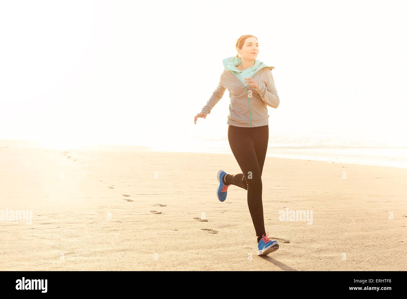 Women running on beach hi-res stock photography and images - Alamy