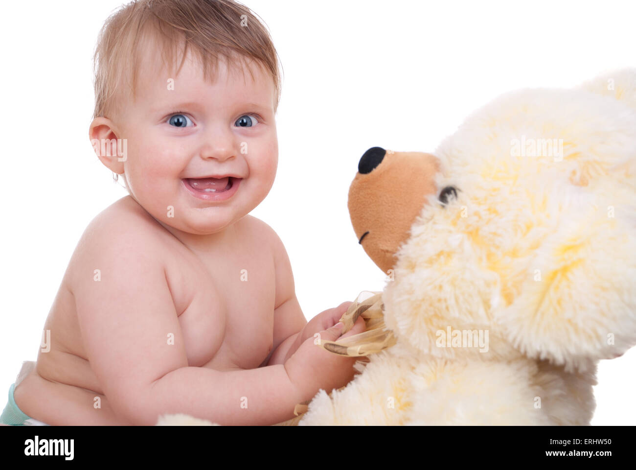 smiling baby playing with teddy bear Stock Photo - Alamy
