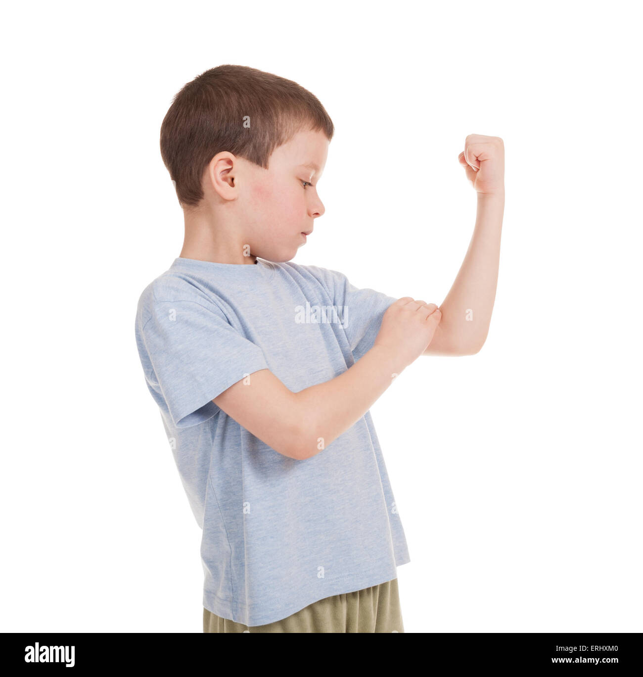 Boy show biceps isolated on white Stock Photo - Alamy