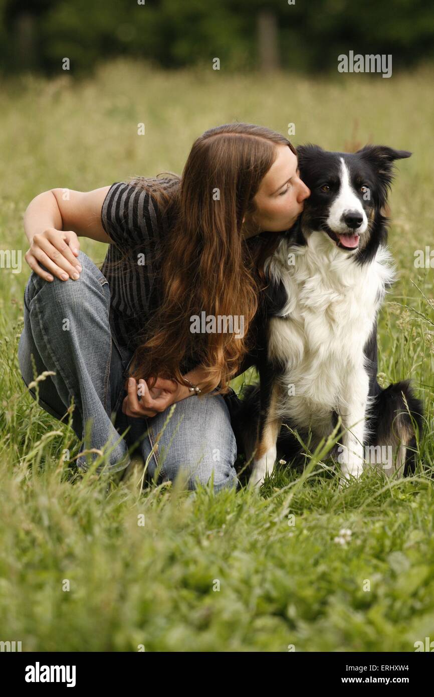 Woman kissing dog tongue hi-res stock photography and images - Alamy