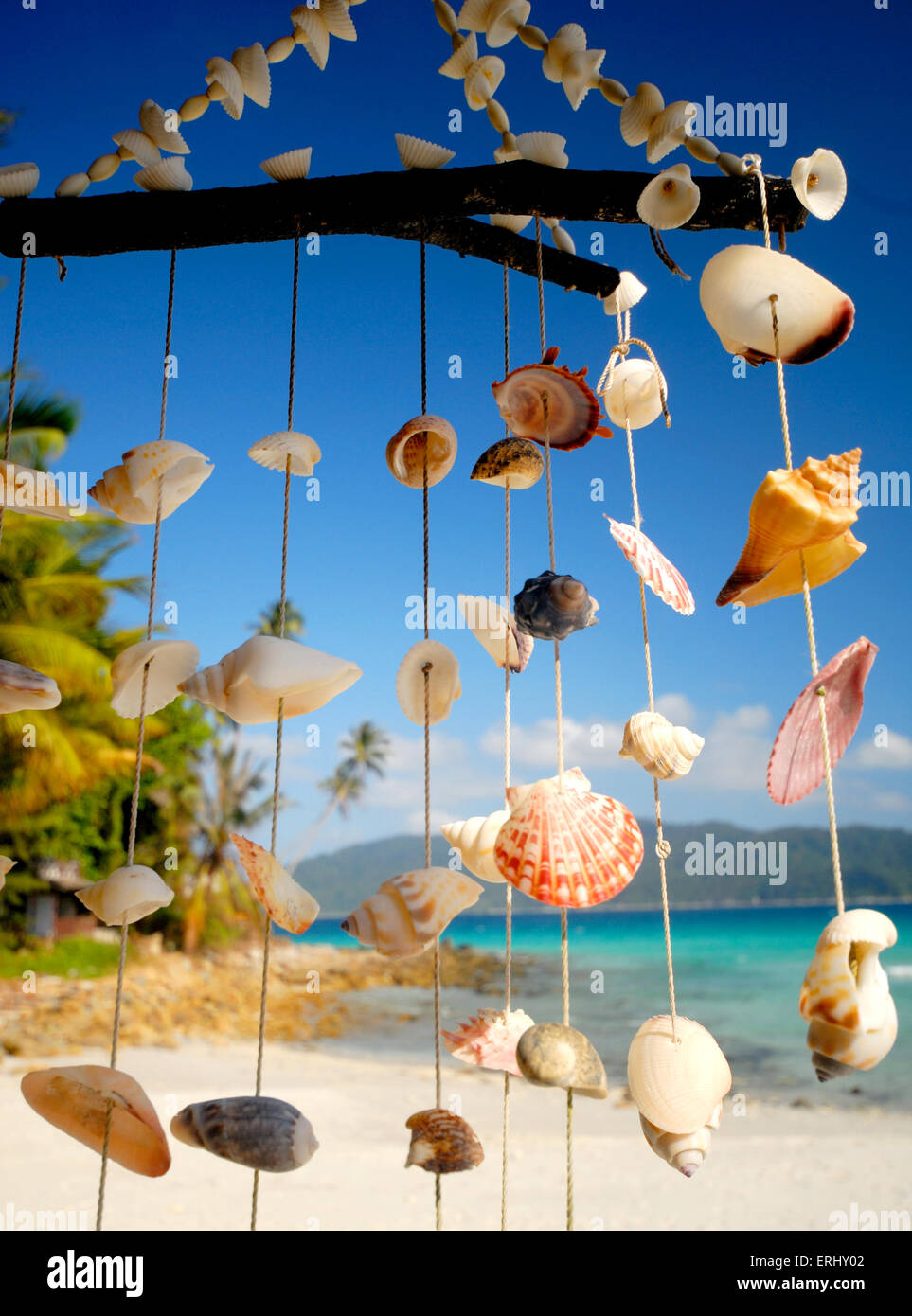 Sea shell chime overlooking a tropical lagoon Stock Photo - Alamy