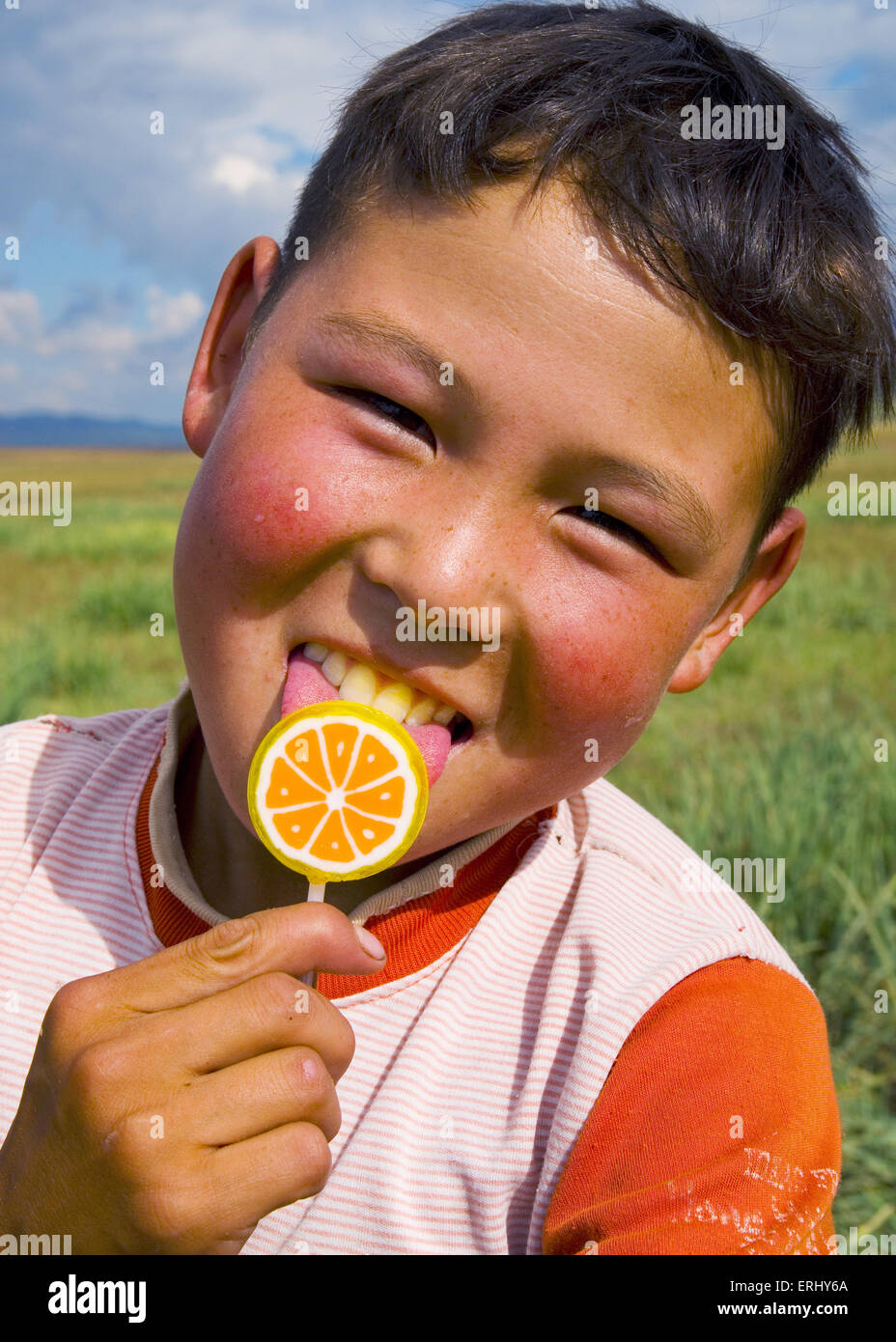 Happiness Asian boy with his candy Stock Photo - Alamy