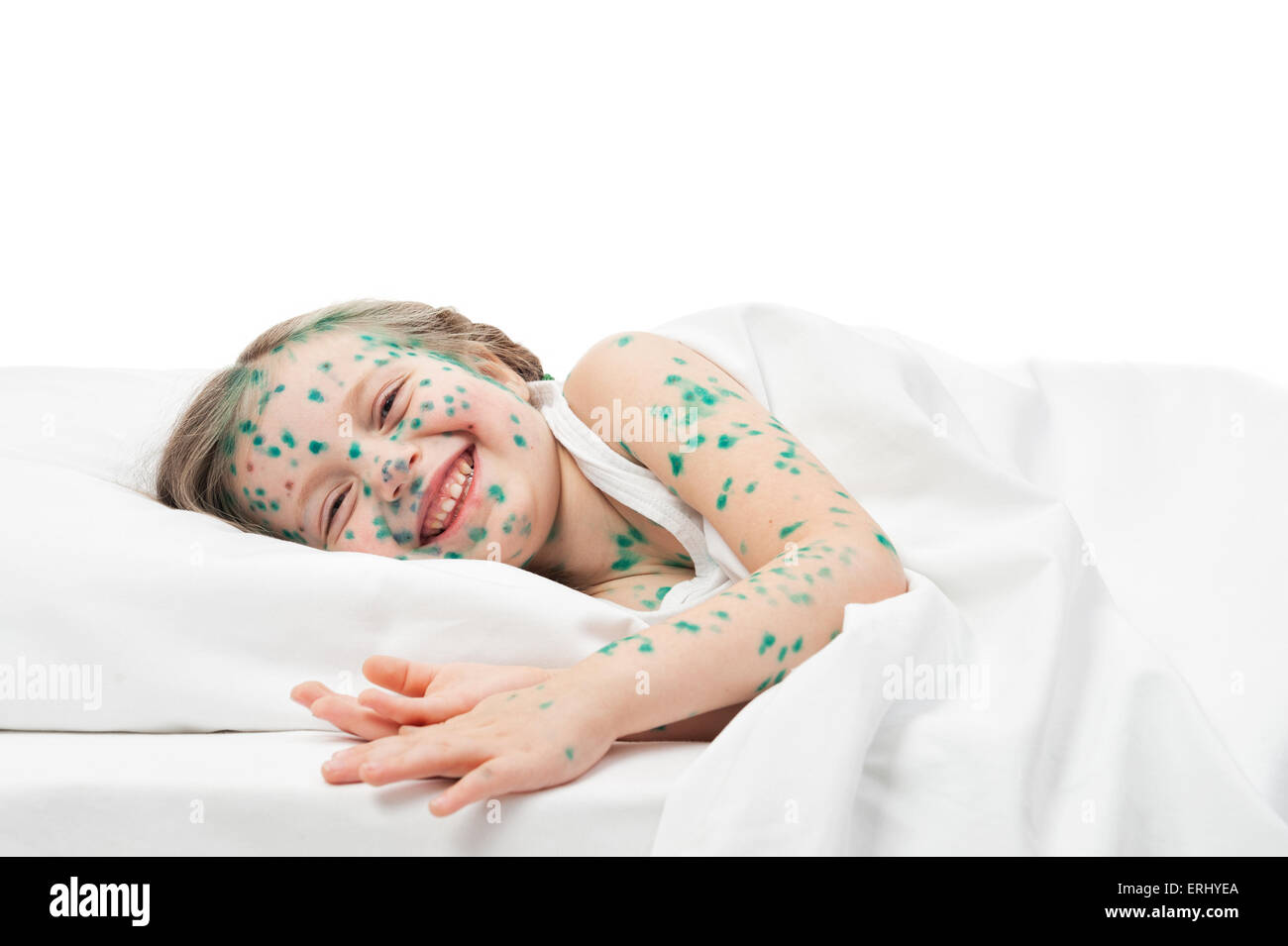 sick girl smile in white bed Stock Photo - Alamy