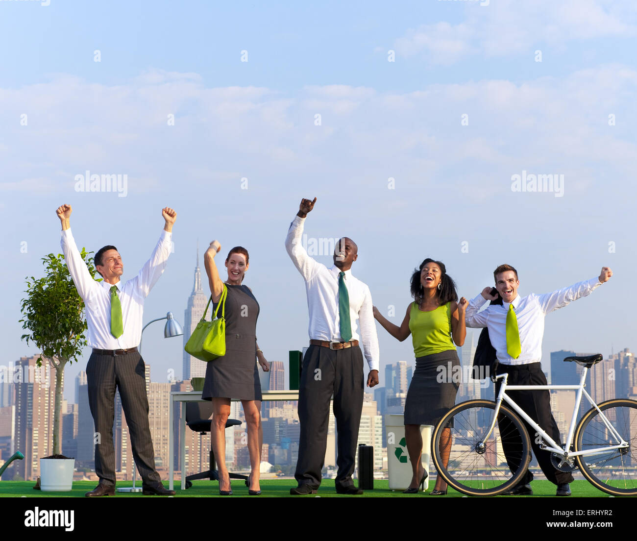Green business people celebrating Stock Photo - Alamy