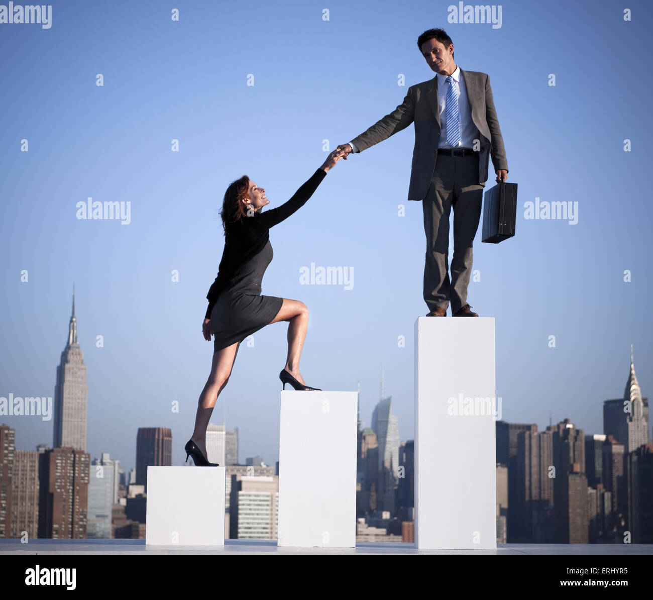 Businessman helping a colleague to succeed Stock Photo - Alamy