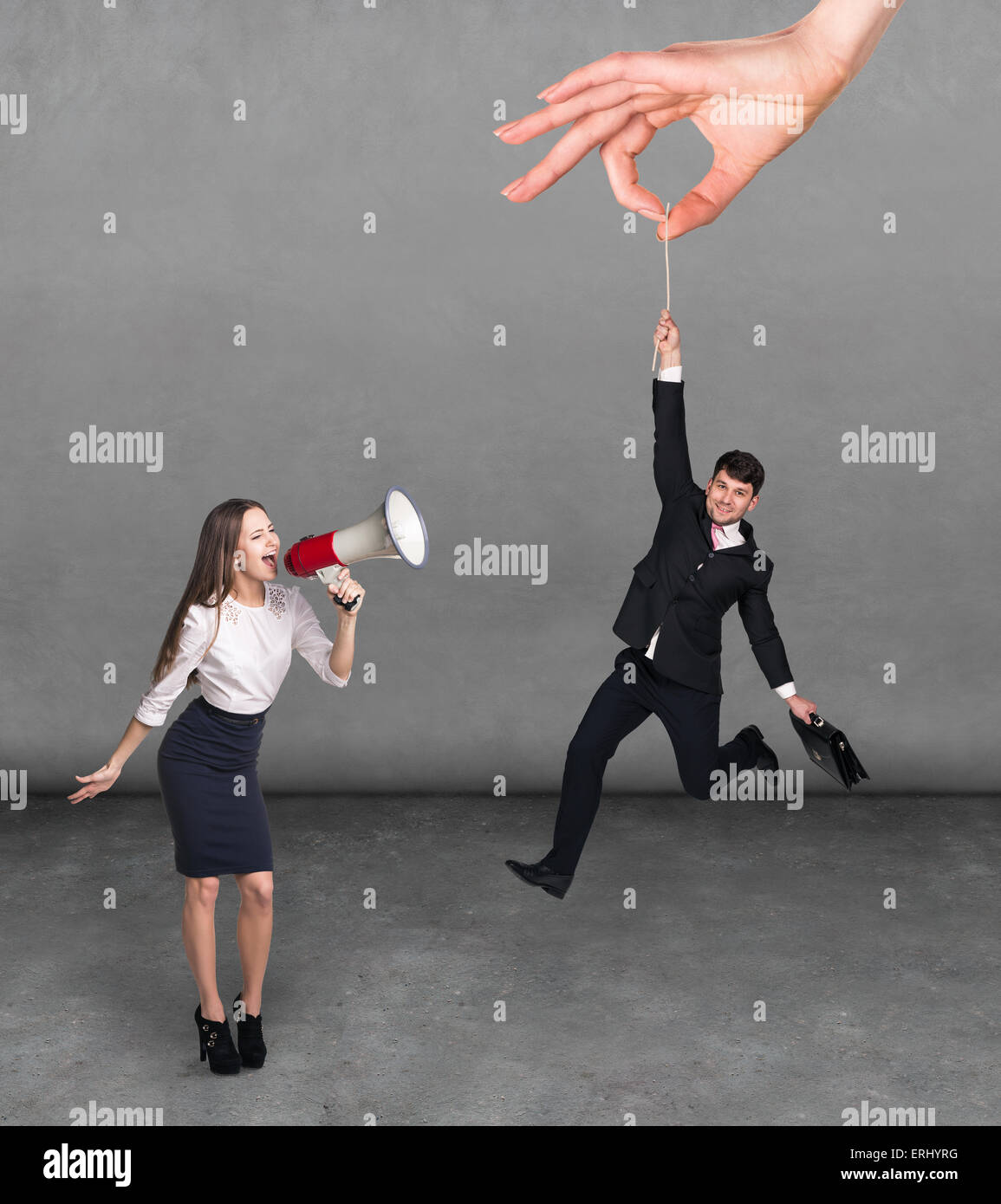 Big hand holding a business man Stock Photo - Alamy