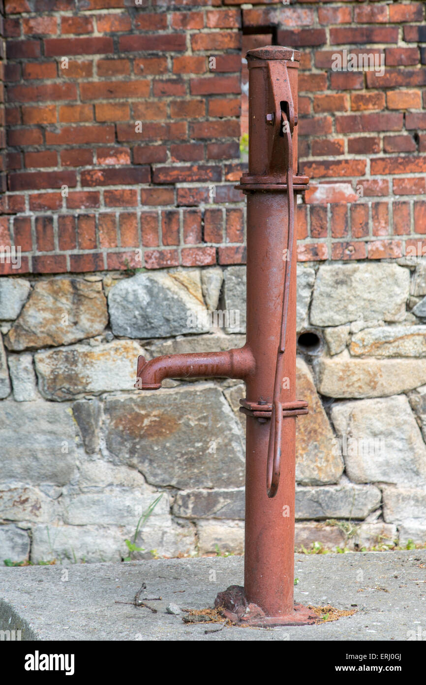 Old metal corroded brown manual rusty pump Stock Photo - Alamy