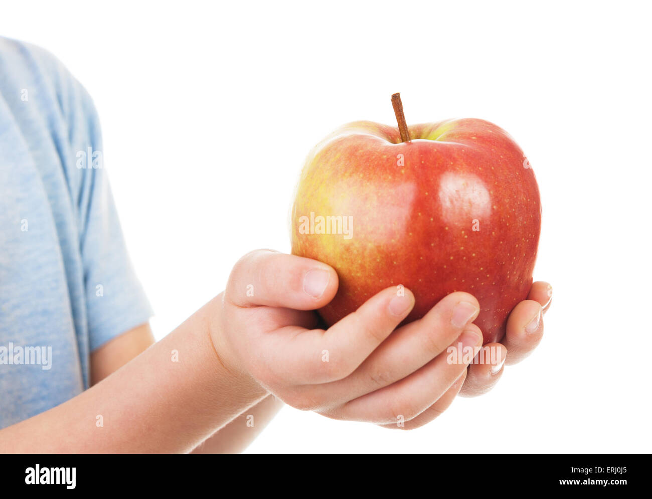 apple in child hands isolated Stock Photo - Alamy