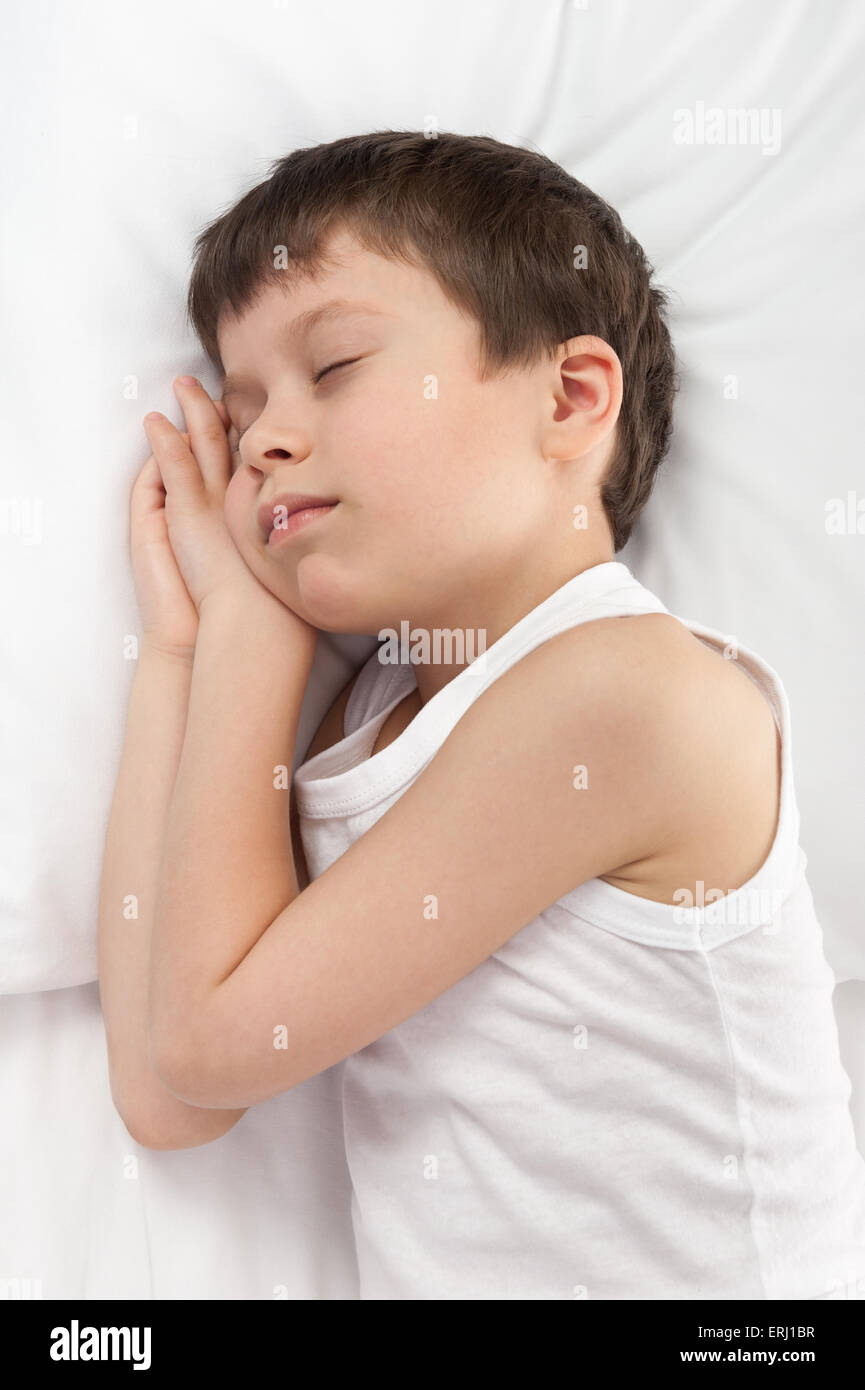 cheerful boy sleep in white bed Stock Photo - Alamy