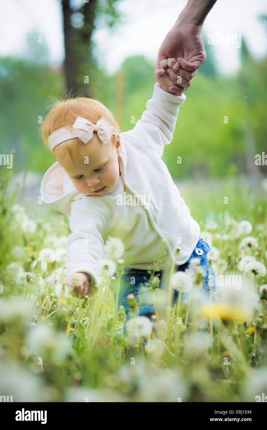 Outdoor portrait of a cute little baby in the grass Stock Photo - Alamy