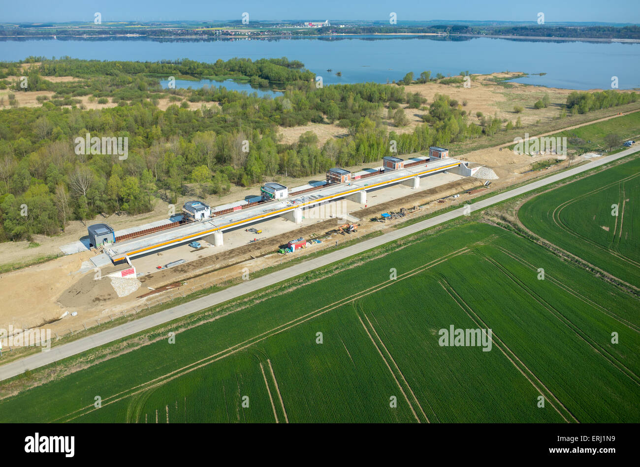 Construction of a modern dam on the lake Stock Photo - Alamy