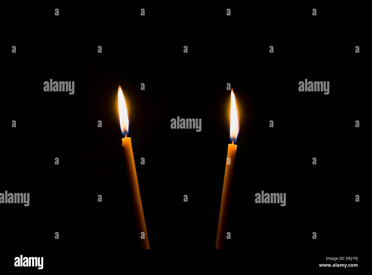 Two candle lights in the dark Stock Photo - Alamy