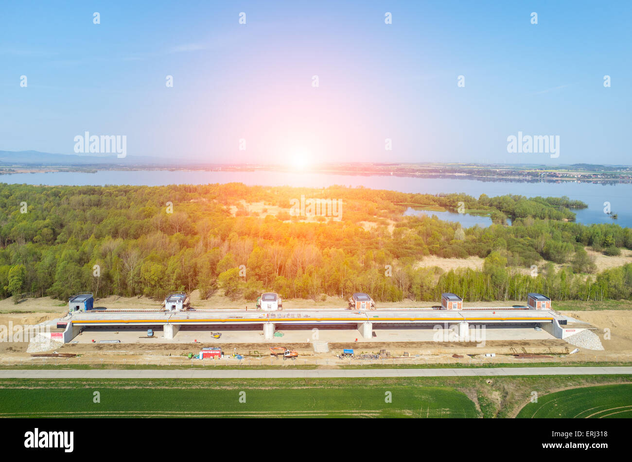 Construction of a modern dam on the lake Stock Photo - Alamy