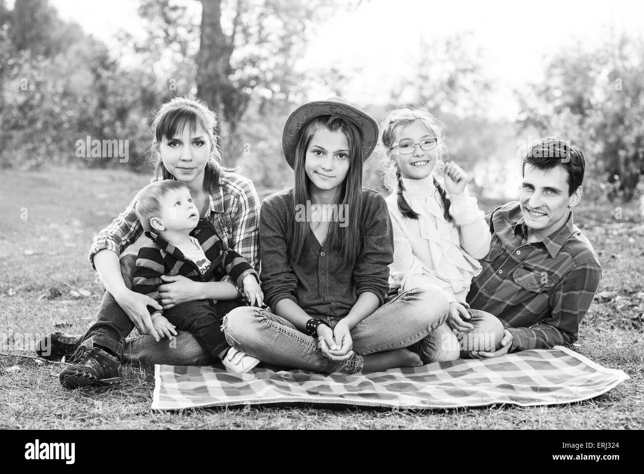 Happy family outdoors Stock Photo - Alamy