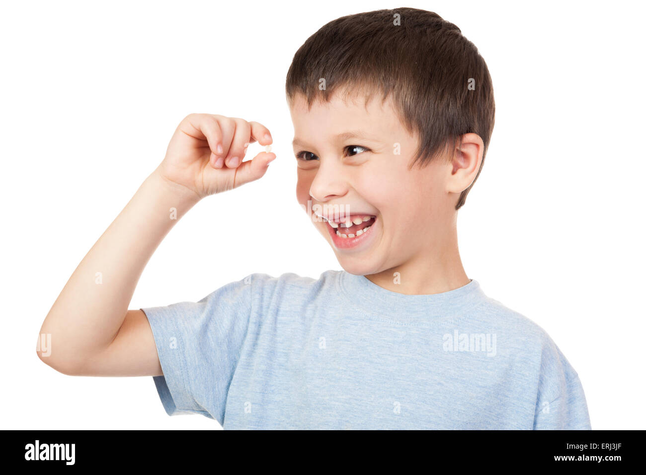 boy looks at lost tooth Stock Photo - Alamy