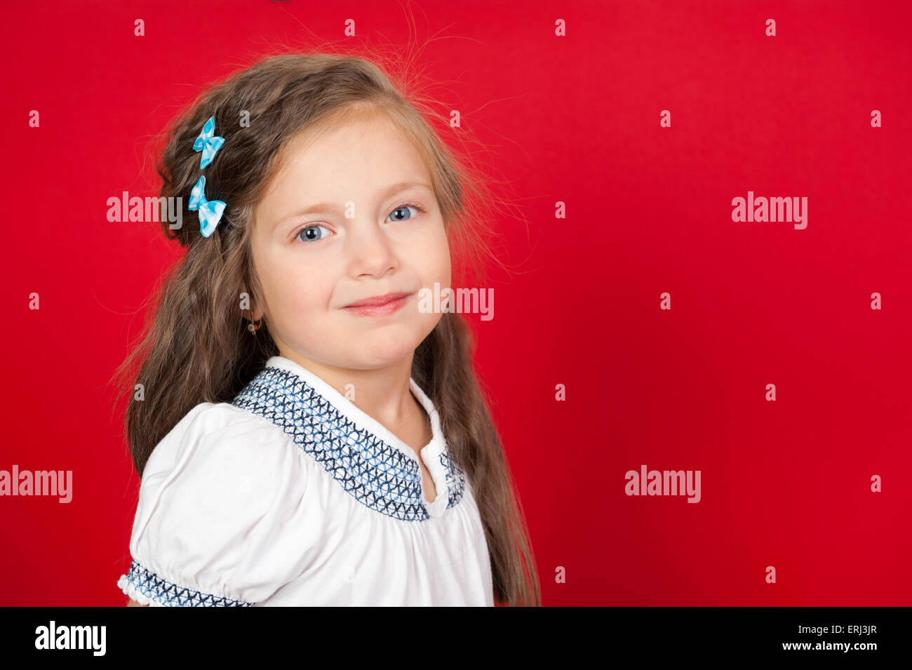smiling girl portrait on red Stock Photo - Alamy