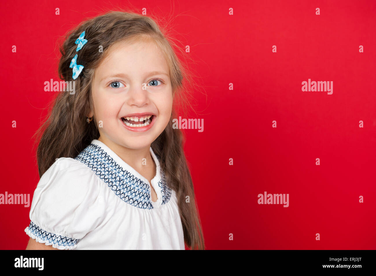 smiling girl portrait on red Stock Photo - Alamy
