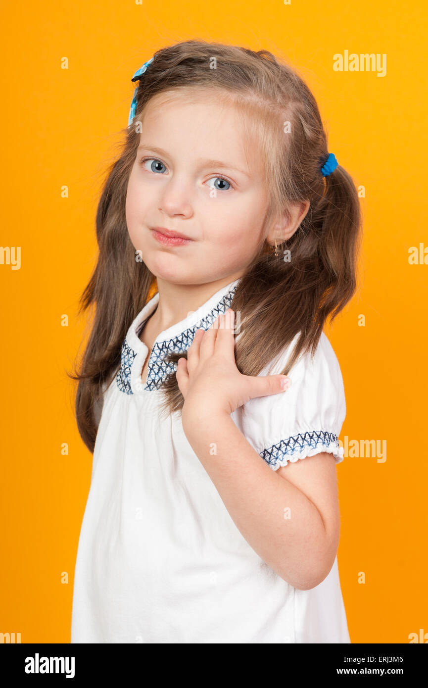 smiling girl portrait on yellow Stock Photo - Alamy