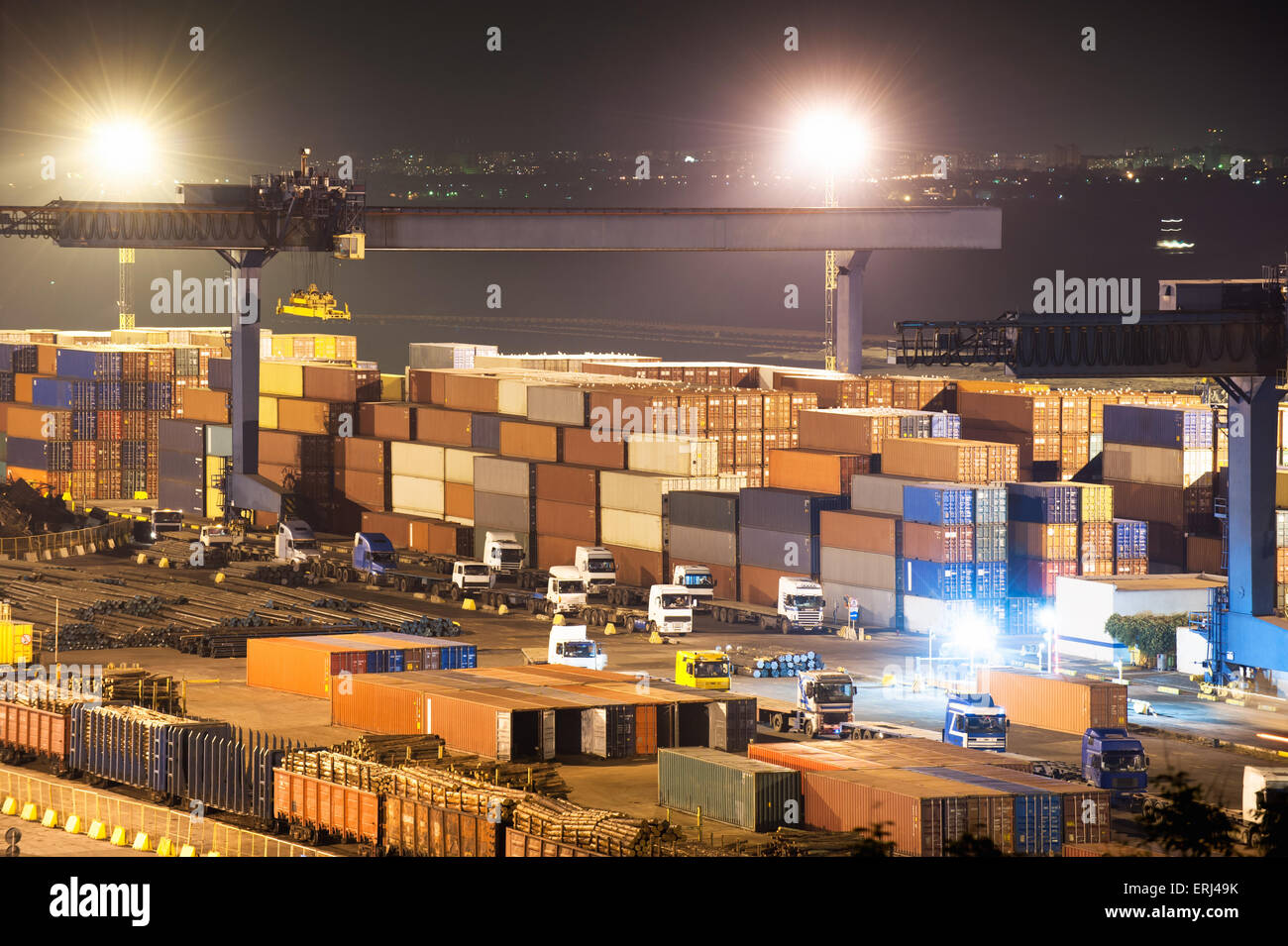 Containers in port at night Stock Photo - Alamy
