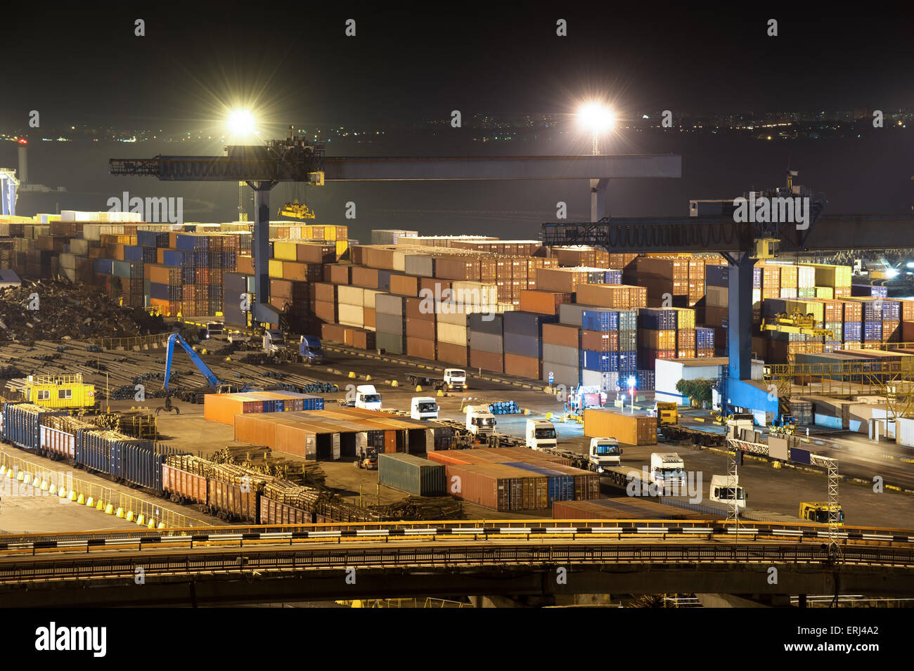 night industrial port. containers and trucks Stock Photo - Alamy