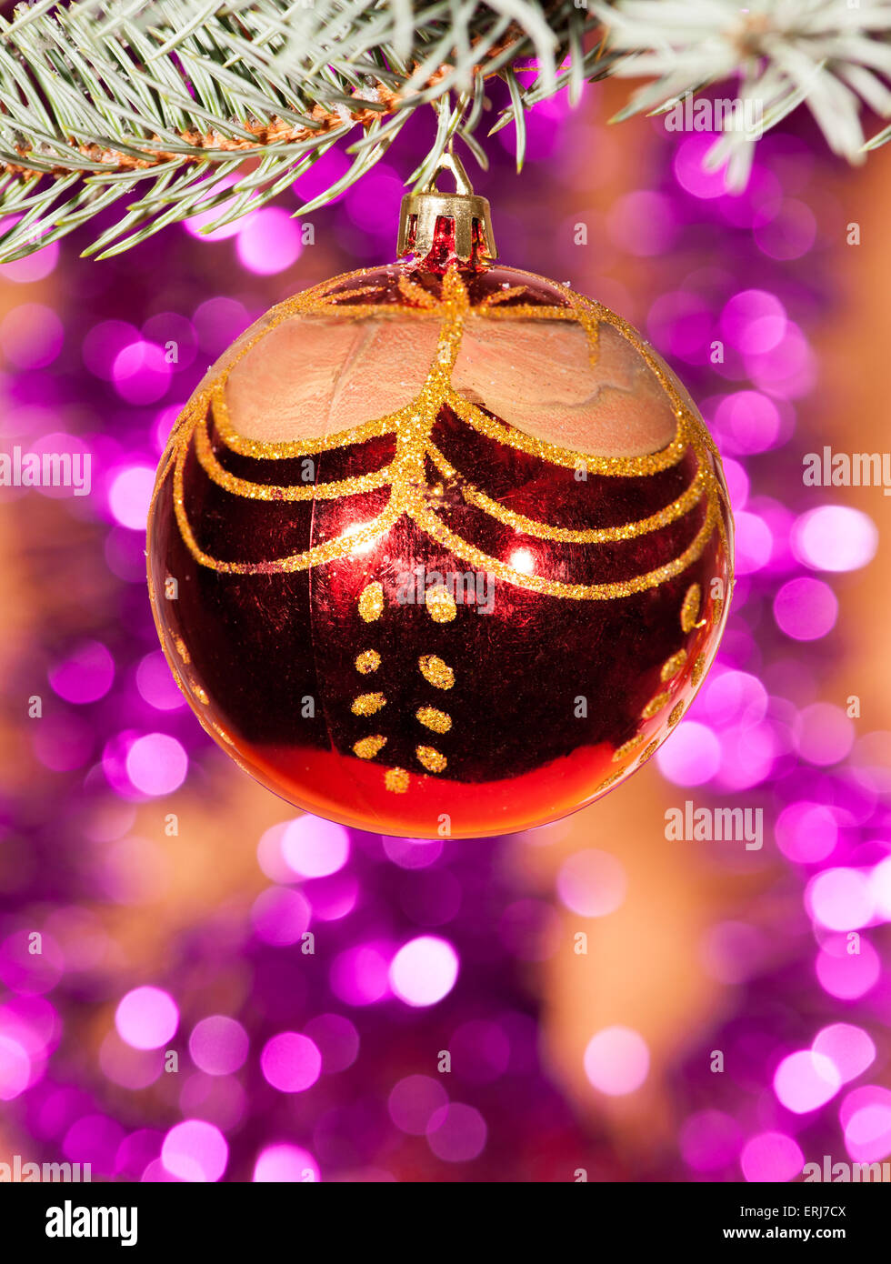 christmas ball on fir tree branch and golden background Stock Photo - Alamy