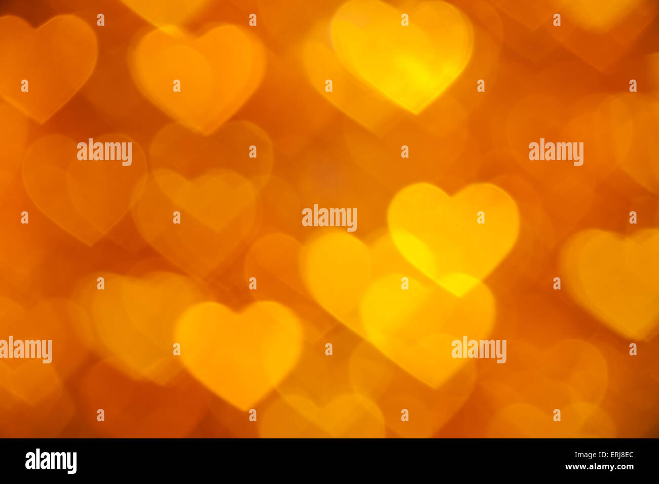golden hearts bokeh as background Stock Photo - Alamy