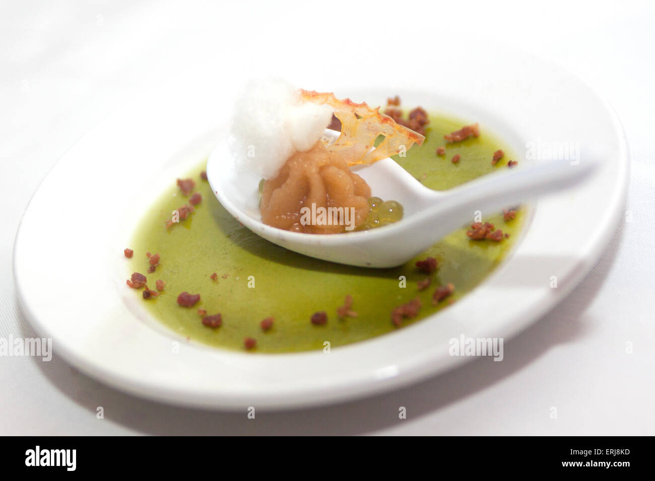 single appetizer spoon on dish Stock Photo - Alamy