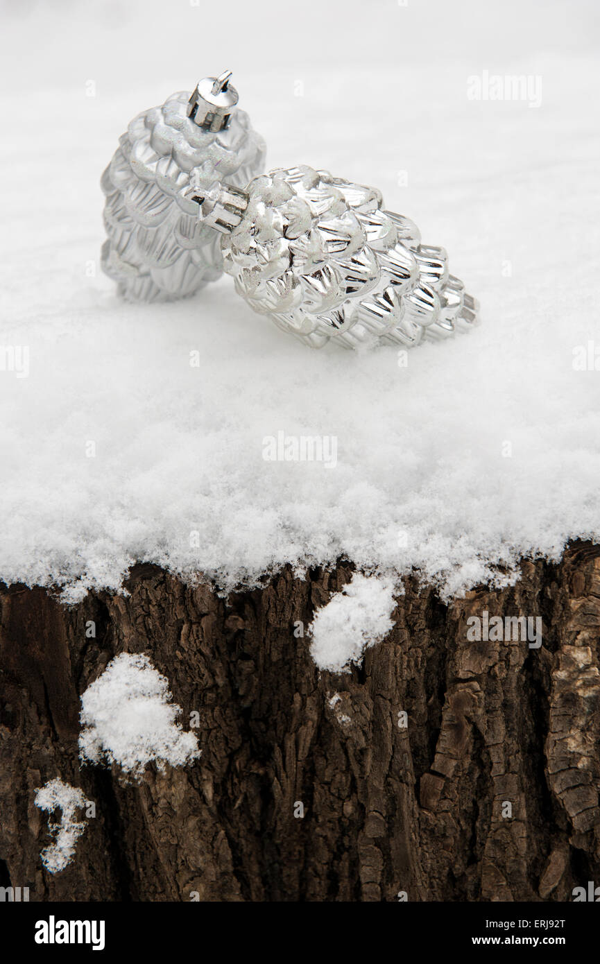 two toy cones on a tree stump in snow Stock Photo - Alamy