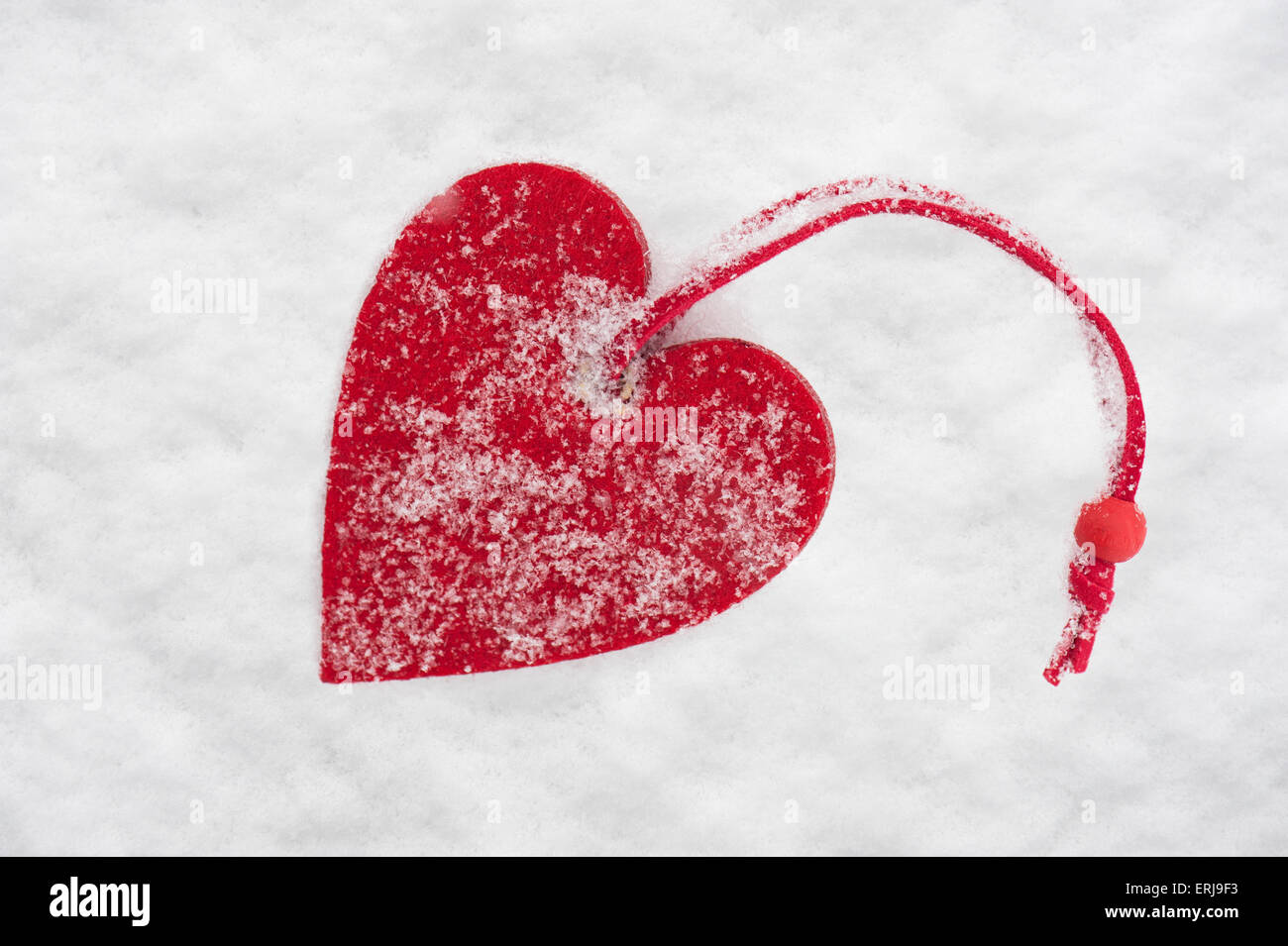 one red heart covered by snow Stock Photo - Alamy