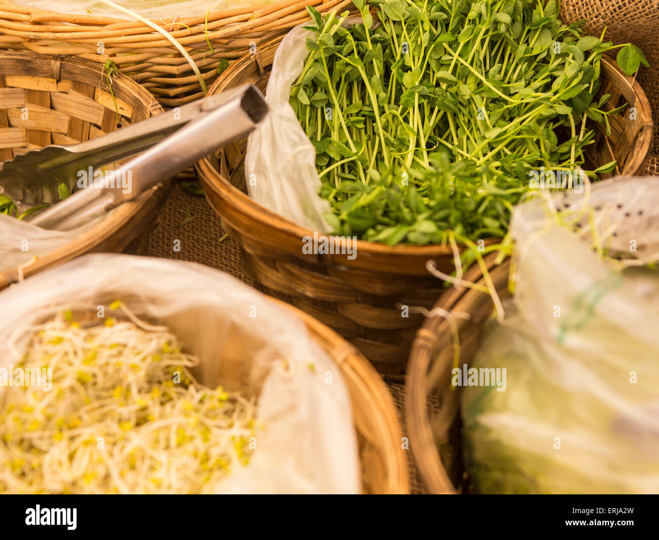 Multiple Baskets of Herbs at a Market with Tongues Stock Photo - Alamy