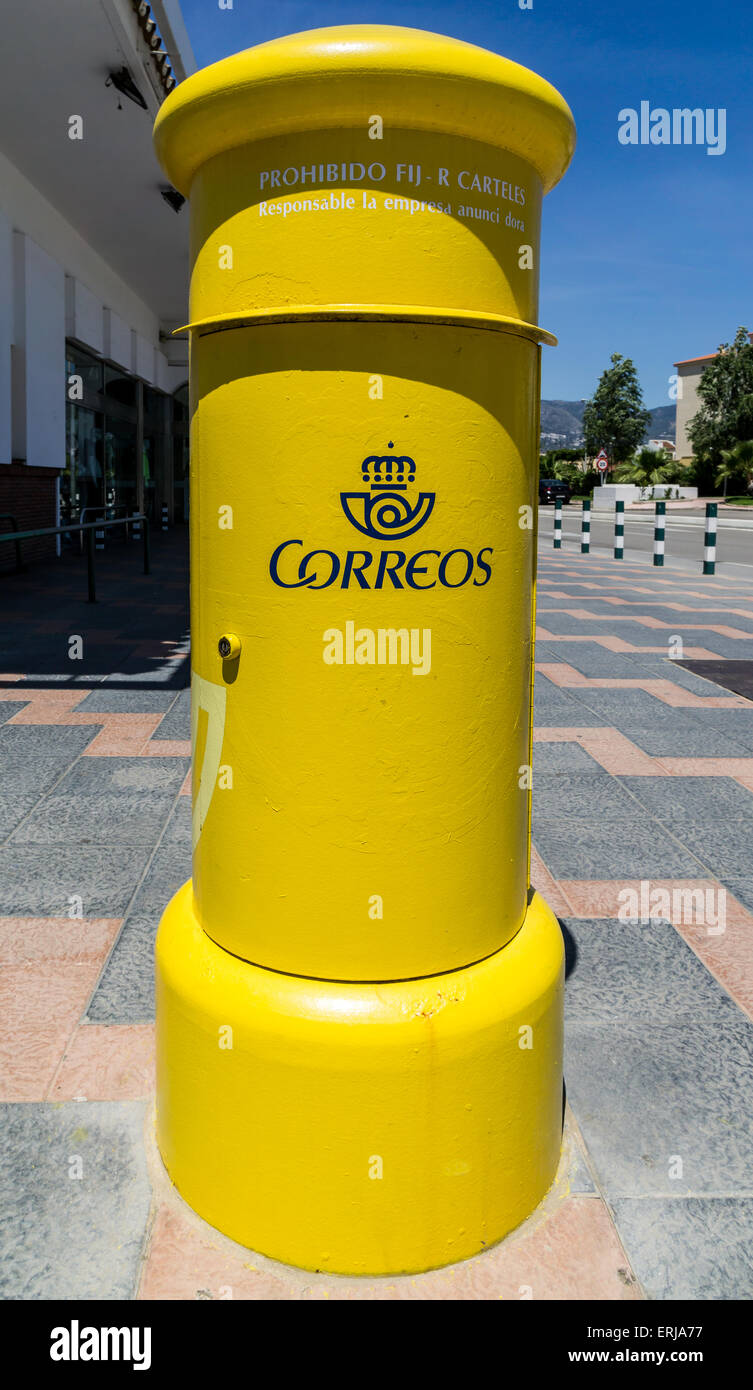 Yellow Correos post box seen in Spain Stock Photo - Alamy