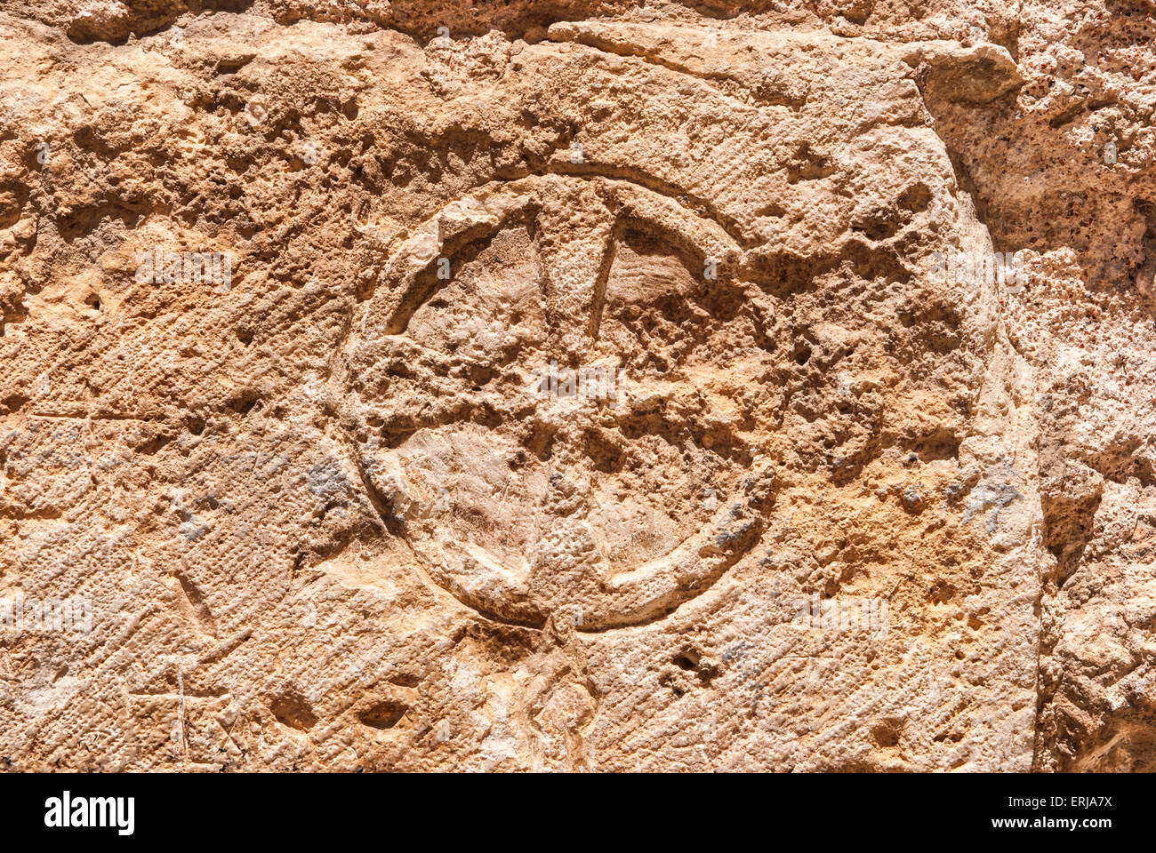 Christian cross of stone wall of the Church of the Holy Sepulchre in ...