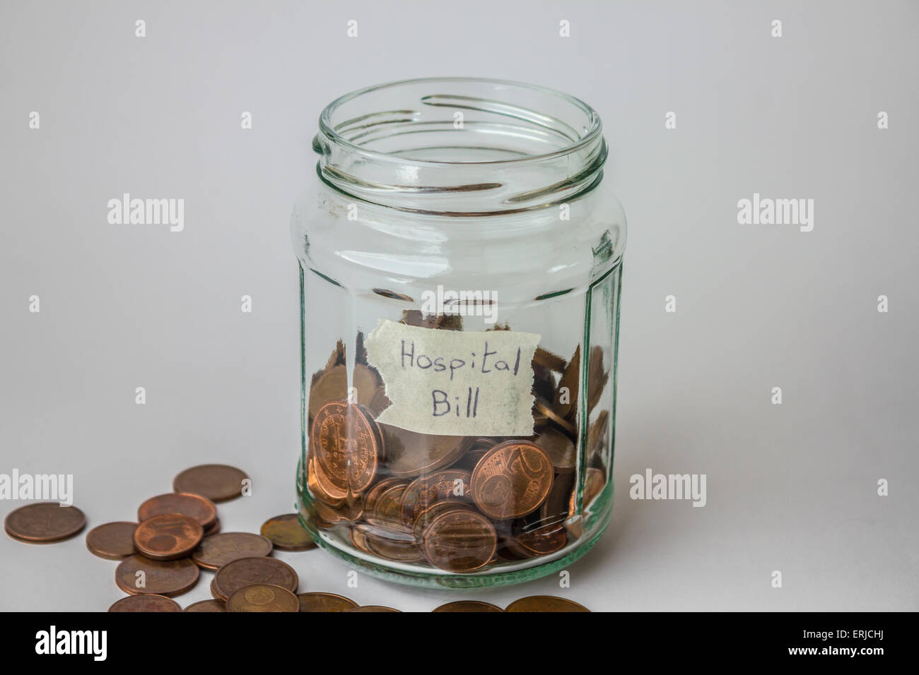 Jar with coins. Savings and tips Stock Photo - Alamy