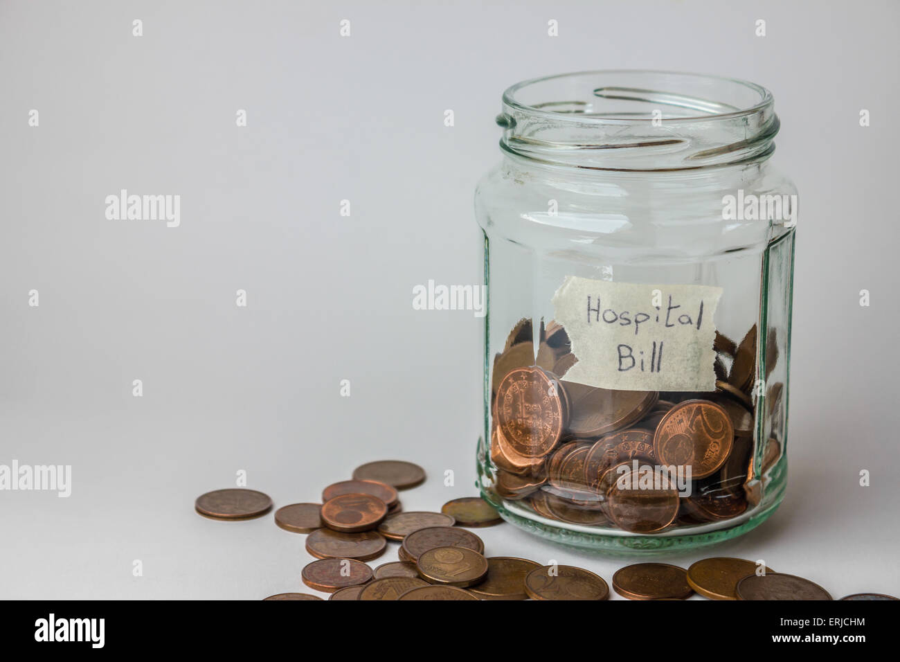 Jar with coins. Savings and tips Stock Photo - Alamy
