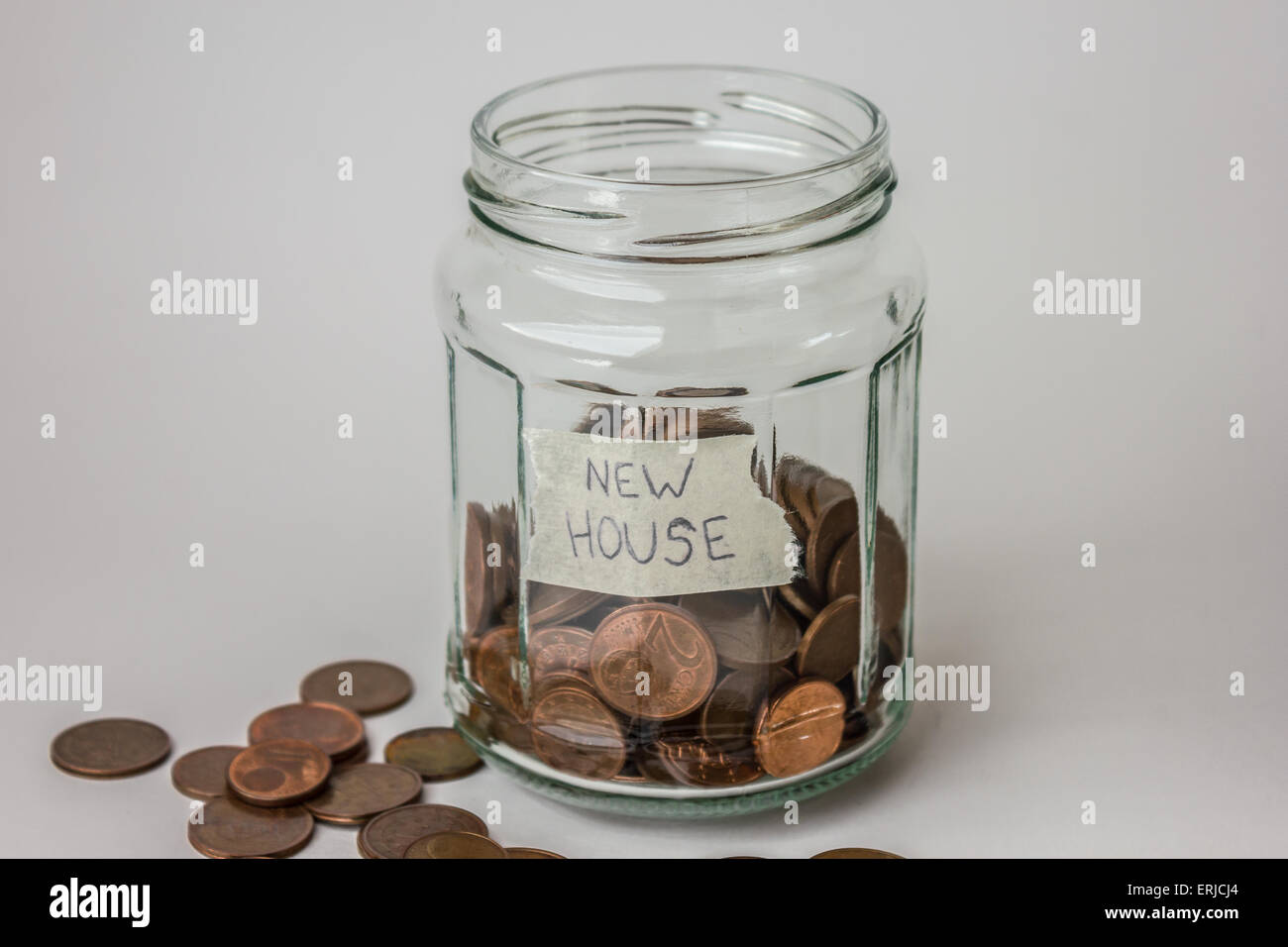 Jar with coins. Savings and tips Stock Photo - Alamy