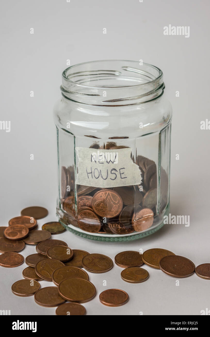 Jar with coins. Savings and tips Stock Photo - Alamy