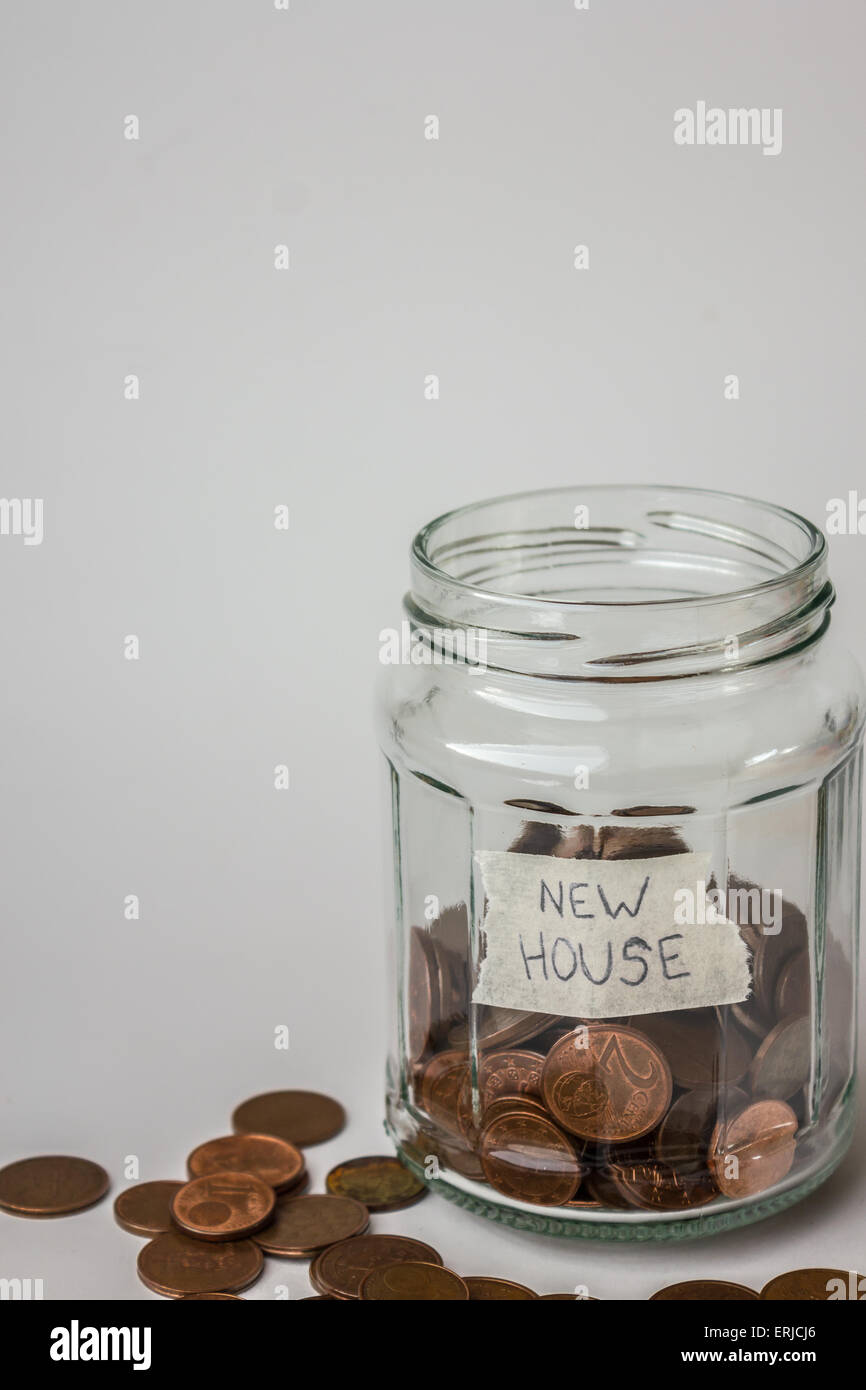 Jar with coins. Savings and tips Stock Photo - Alamy