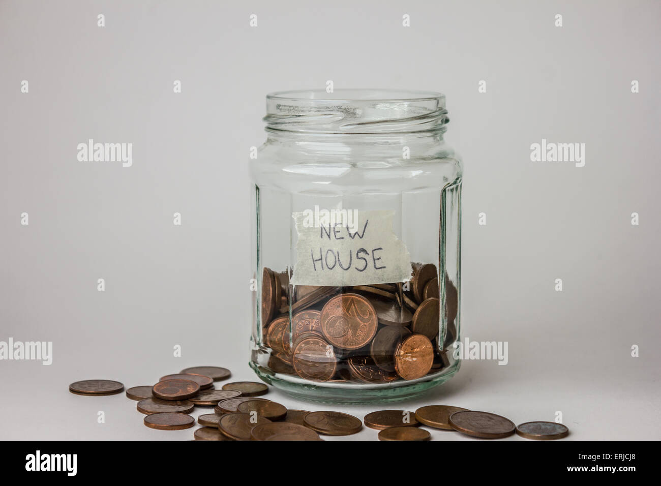 Jar with coins. Savings and tips Stock Photo - Alamy