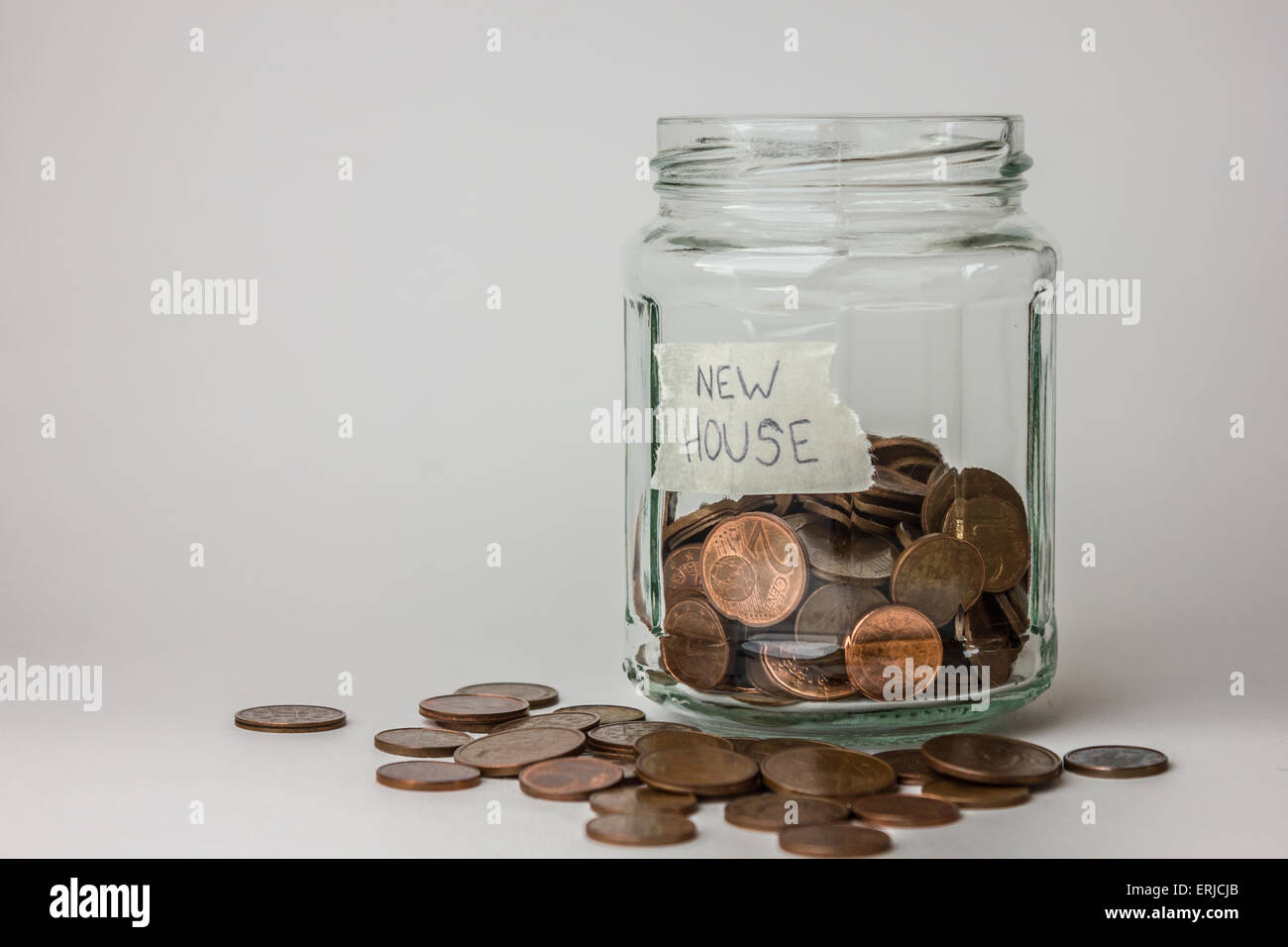 Jar with coins. Savings and tips Stock Photo - Alamy