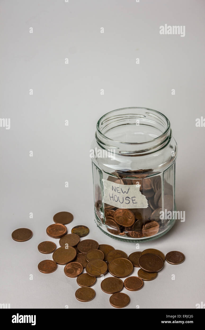 Jar with coins. Savings and tips Stock Photo - Alamy