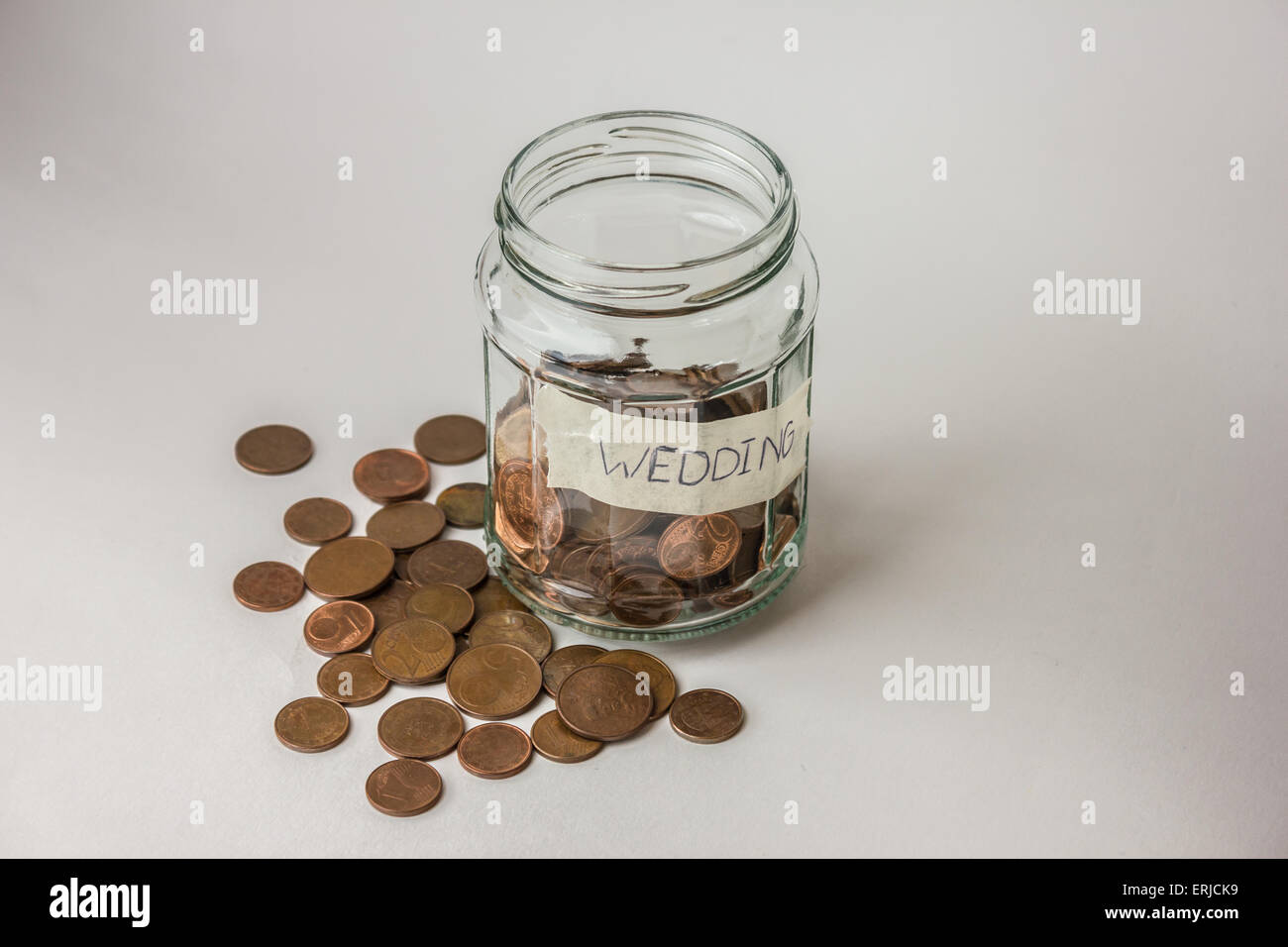 Jar with coins. Savings and tips Stock Photo - Alamy
