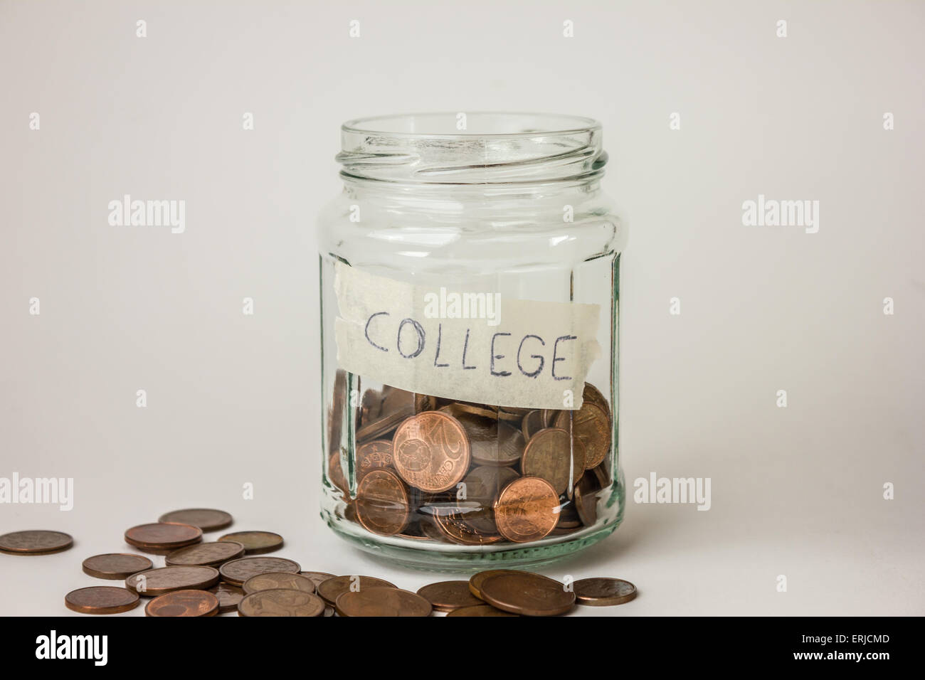 Jar with coins. Savings and tips Stock Photo - Alamy
