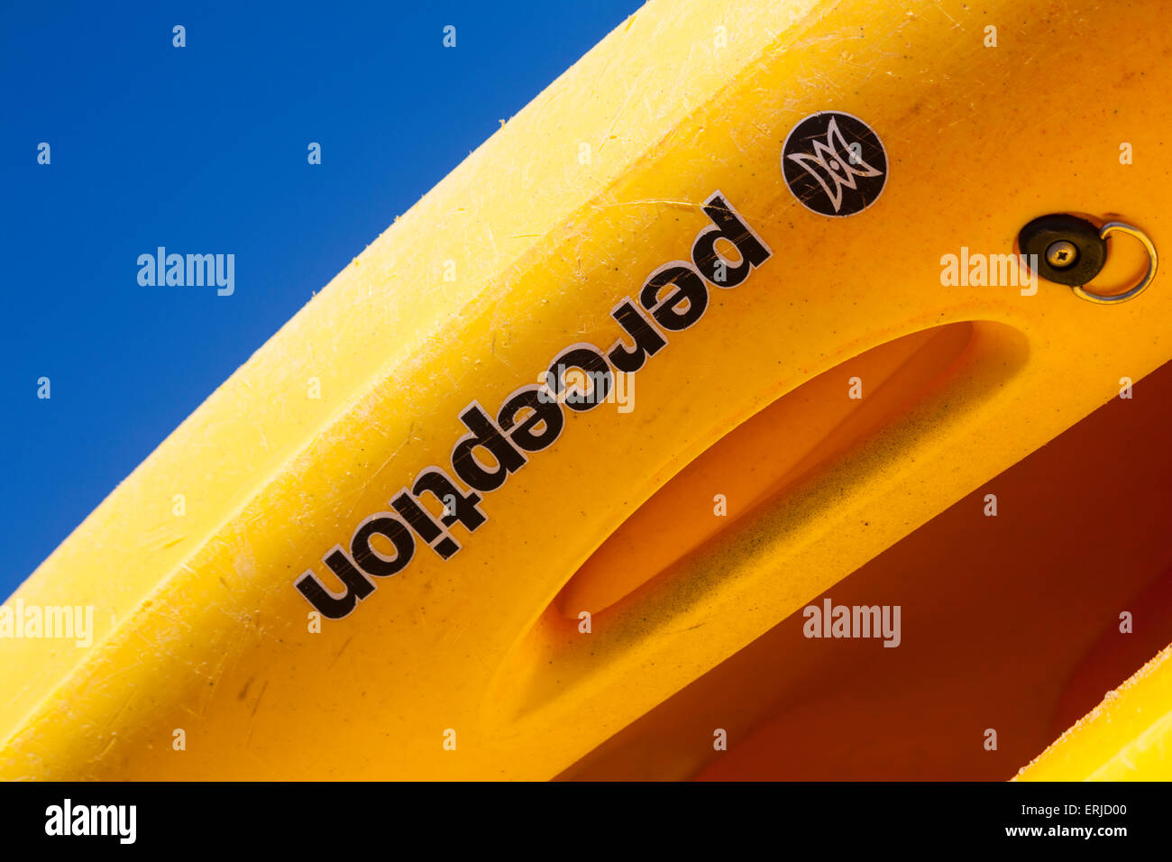 contrasting detail on yellow perception kayak against clear blue sky ...