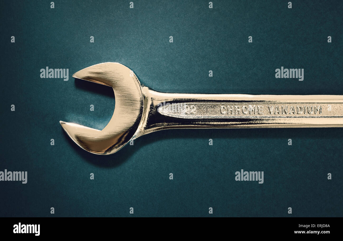 Just one wrench of steel, looks like it is of gold Stock Photo - Alamy